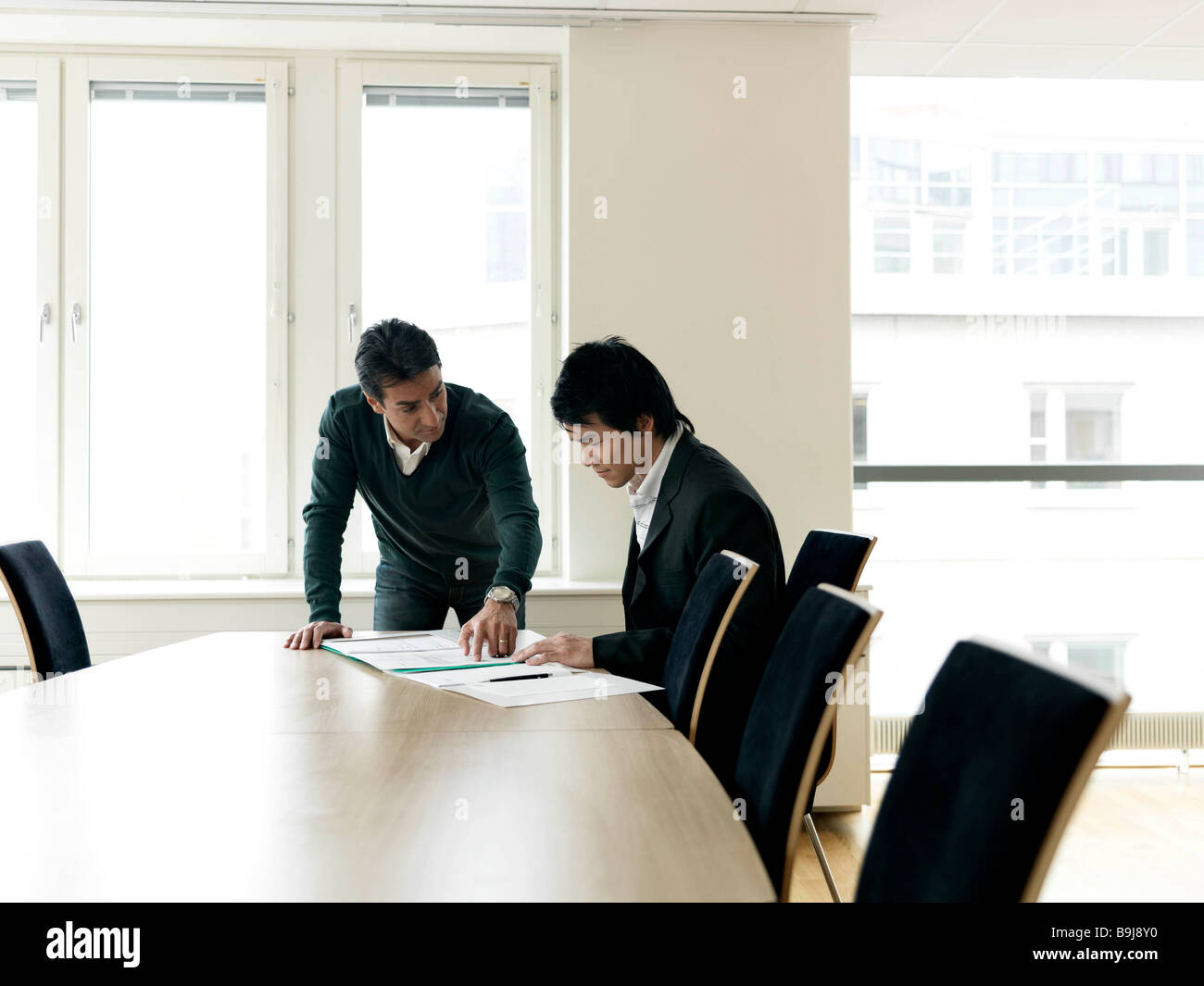 Group colleagues pointing gesturing hi-res stock photography and images ...