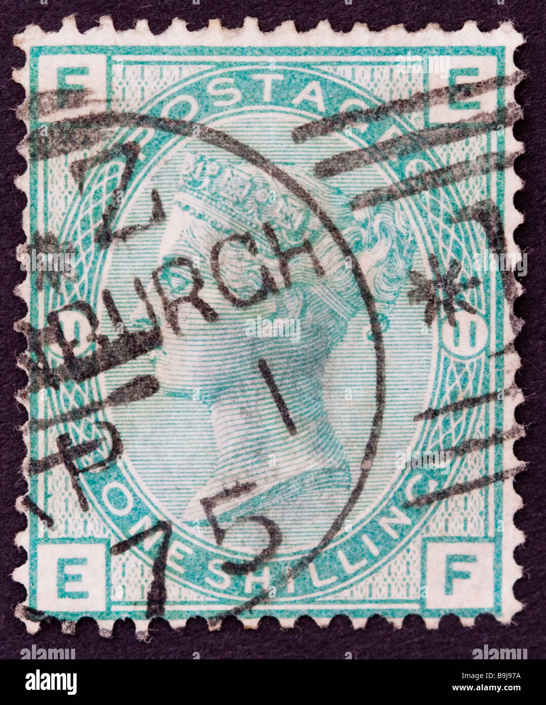 Close up of 1s pale green Victorian British Postal stamp on black ...