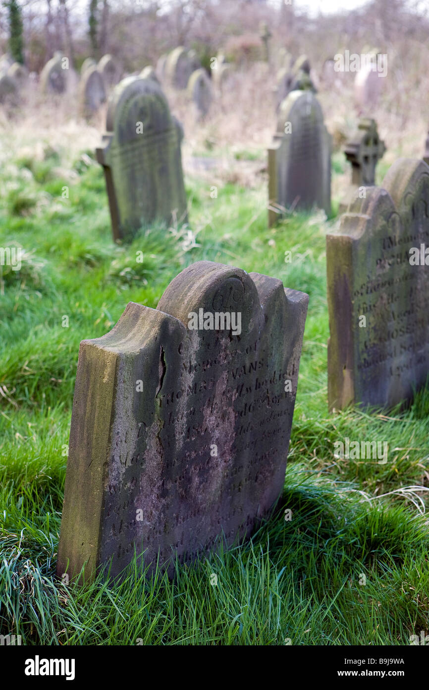 View across a grave yard showing the grave stones disappear into the ...