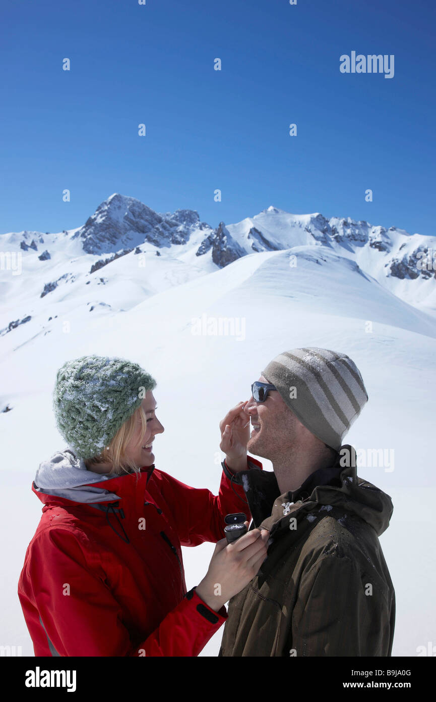 Young couple applying sunscreen hi-res stock photography and images - Alamy