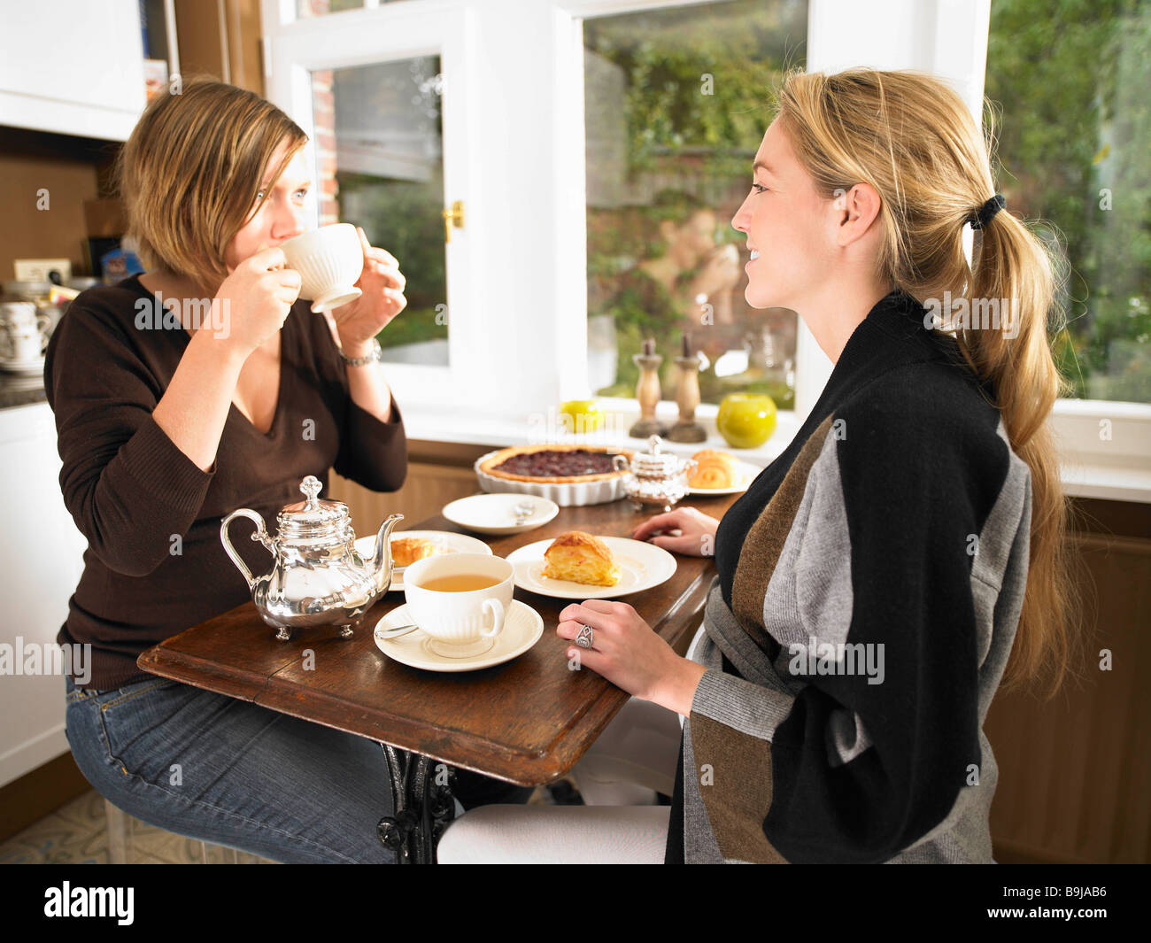 Pregnant women having tea Stock Photo - Alamy
