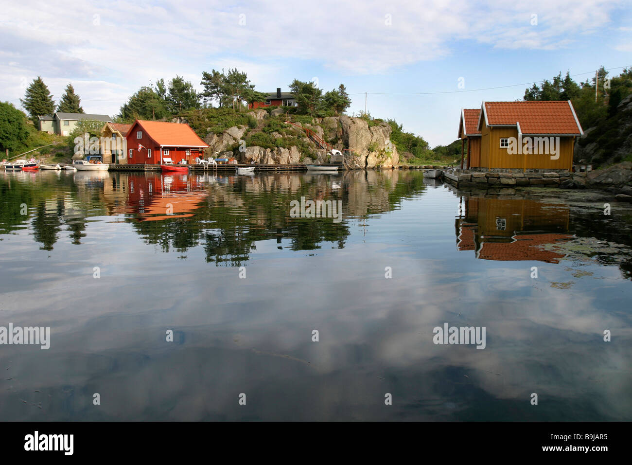 Traditionally built red houses in a fjord near Avik, Norway ...