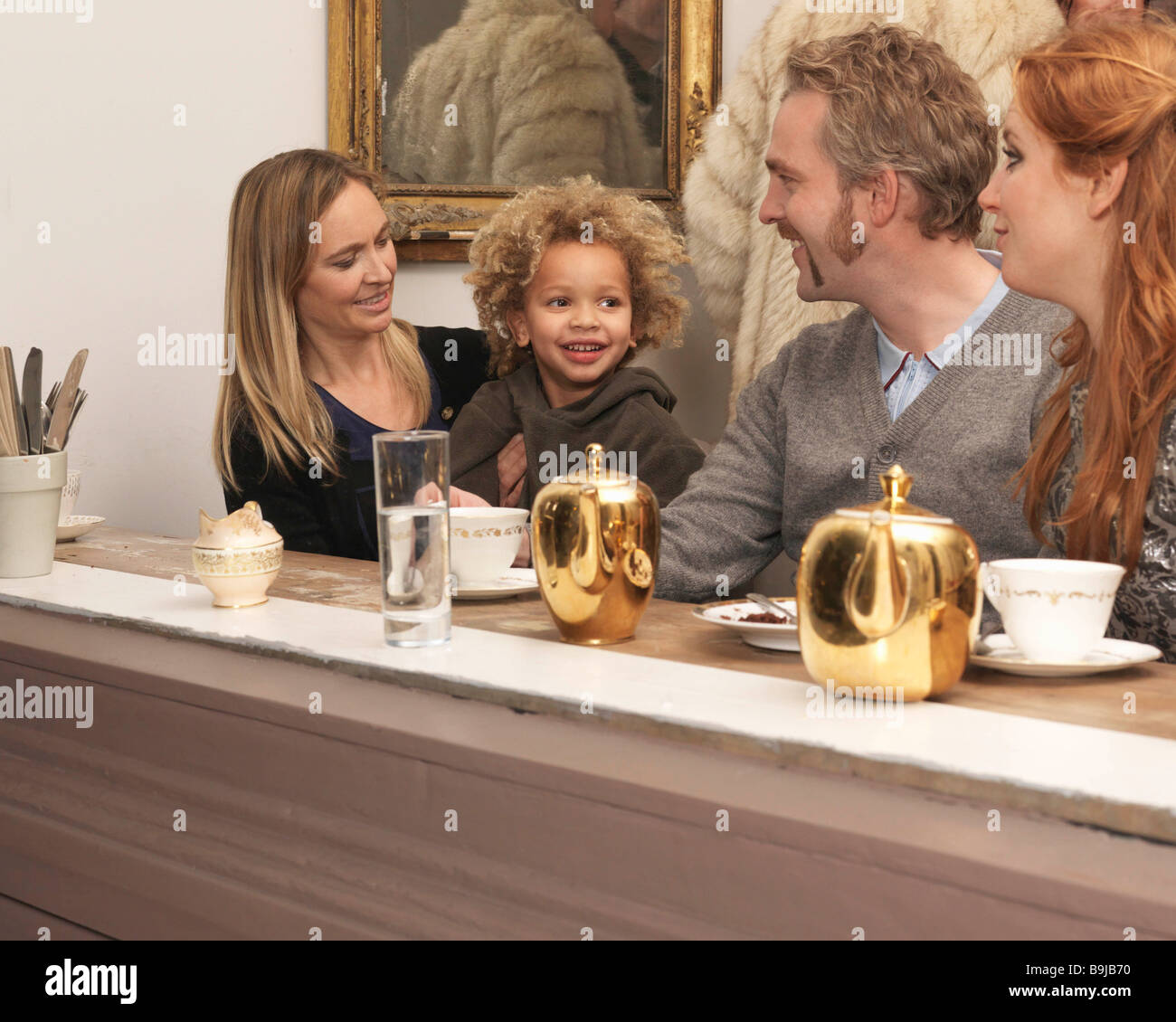 Customers having tea in café Stock Photo - Alamy