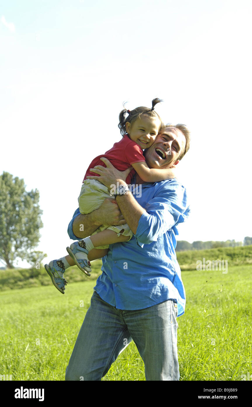 Father daughter carry embraces happily laughing Stock Photo - Alamy