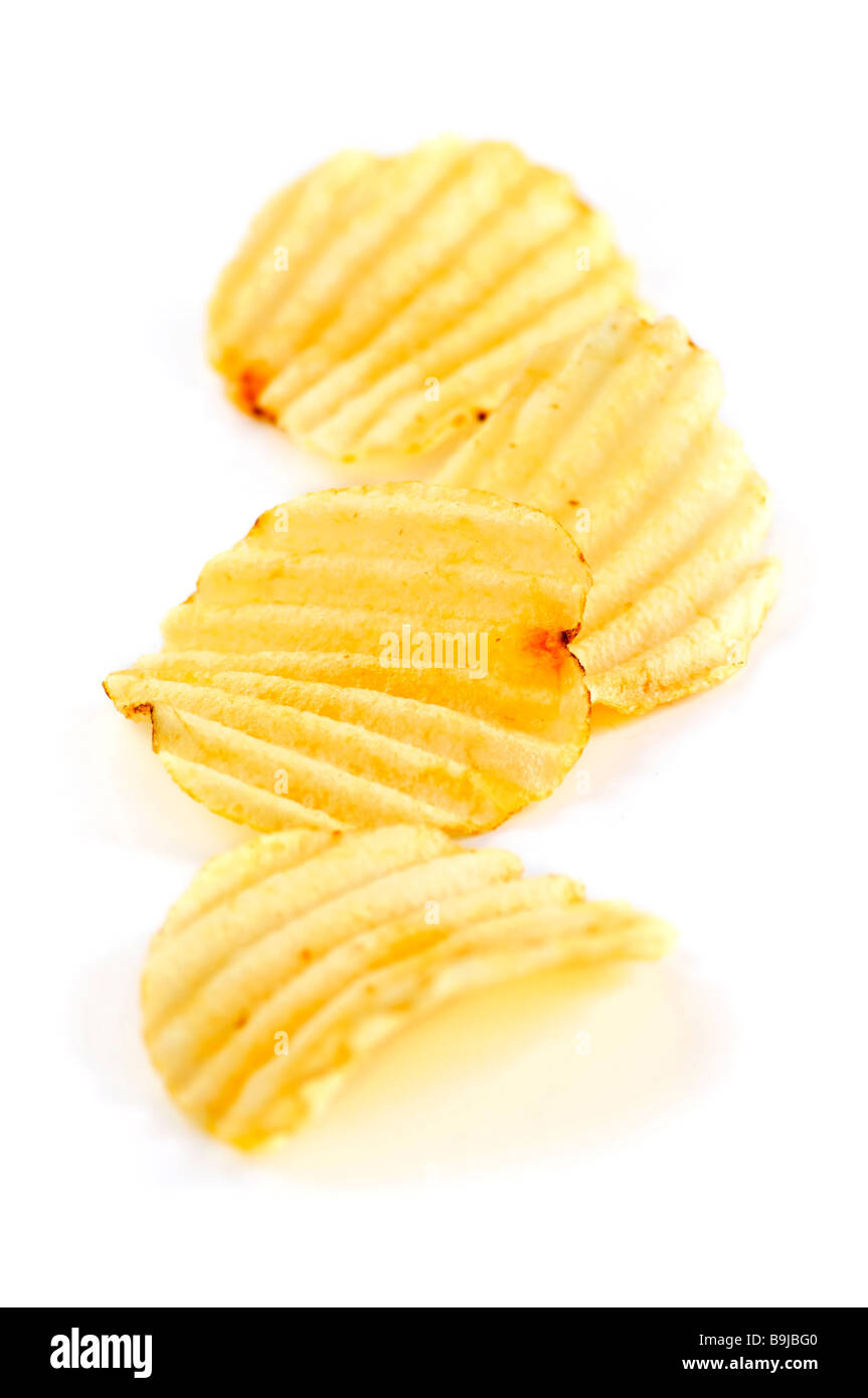 Several potato chips isolated on white background Stock Photo - Alamy