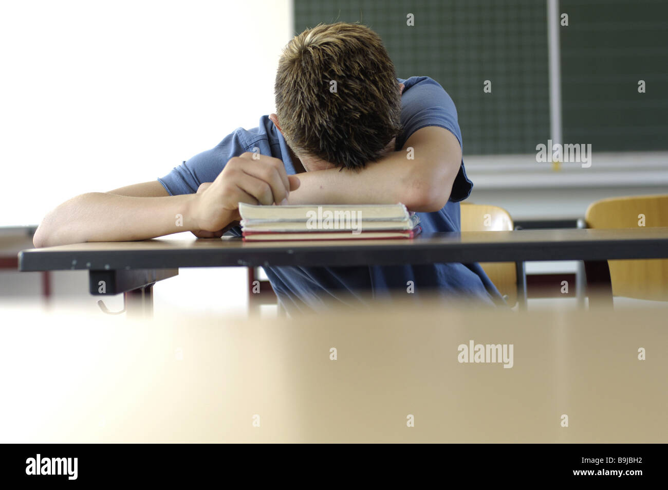teenagers boy school-bank wearily inattentive Stock Photo - Alamy