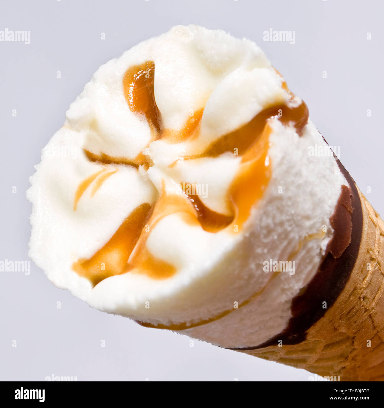 Close up of a mouth watering vanilla ice cream cone Stock Photo - Alamy