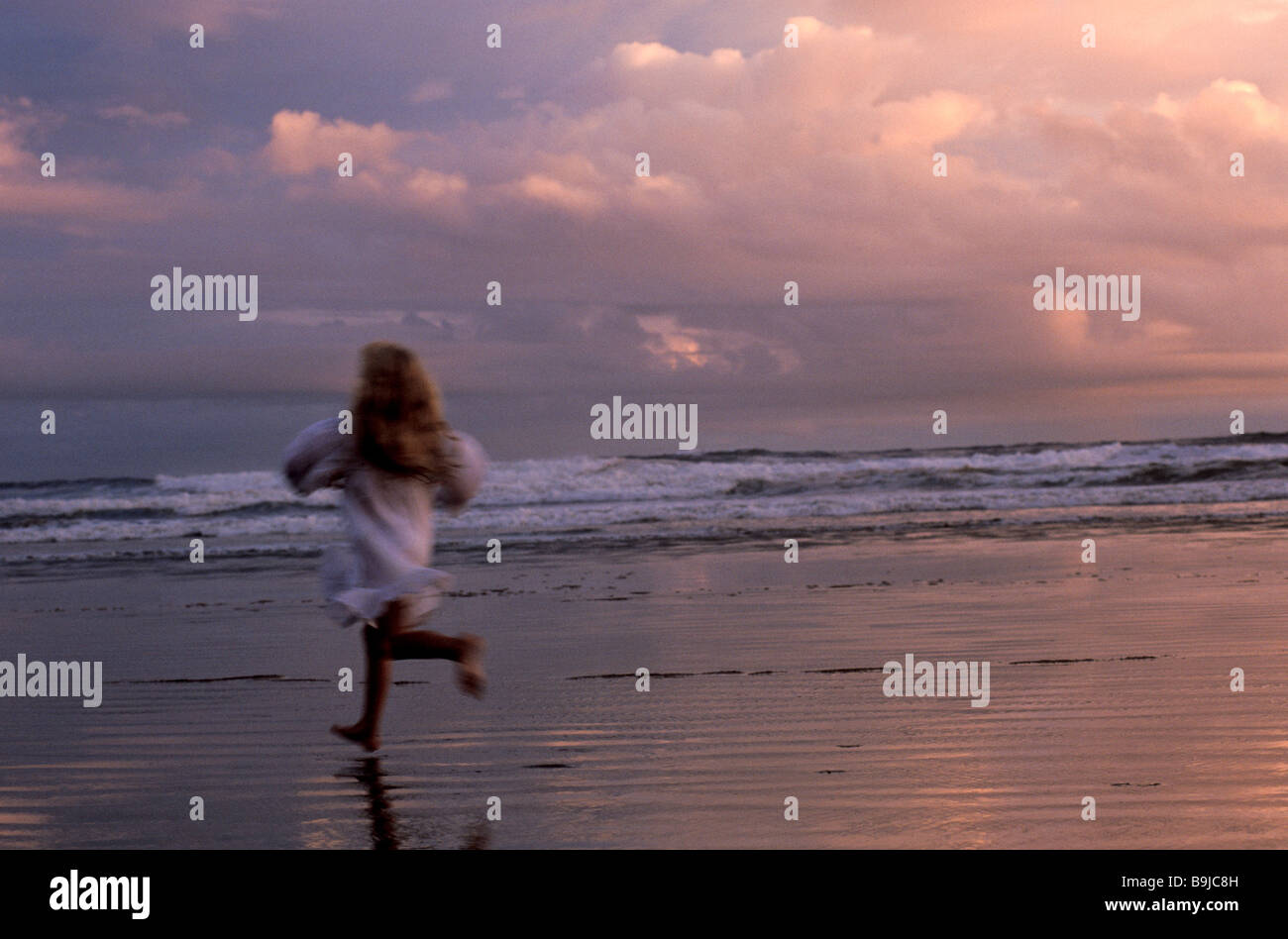 Kids playing in long island surf hi-res stock photography and images ...