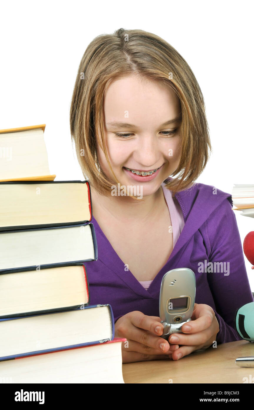 Teenage girl text messaging with cell phone in school Stock Photo - Alamy