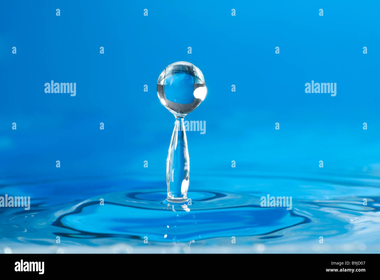 Drop of water, blue Stock Photo - Alamy