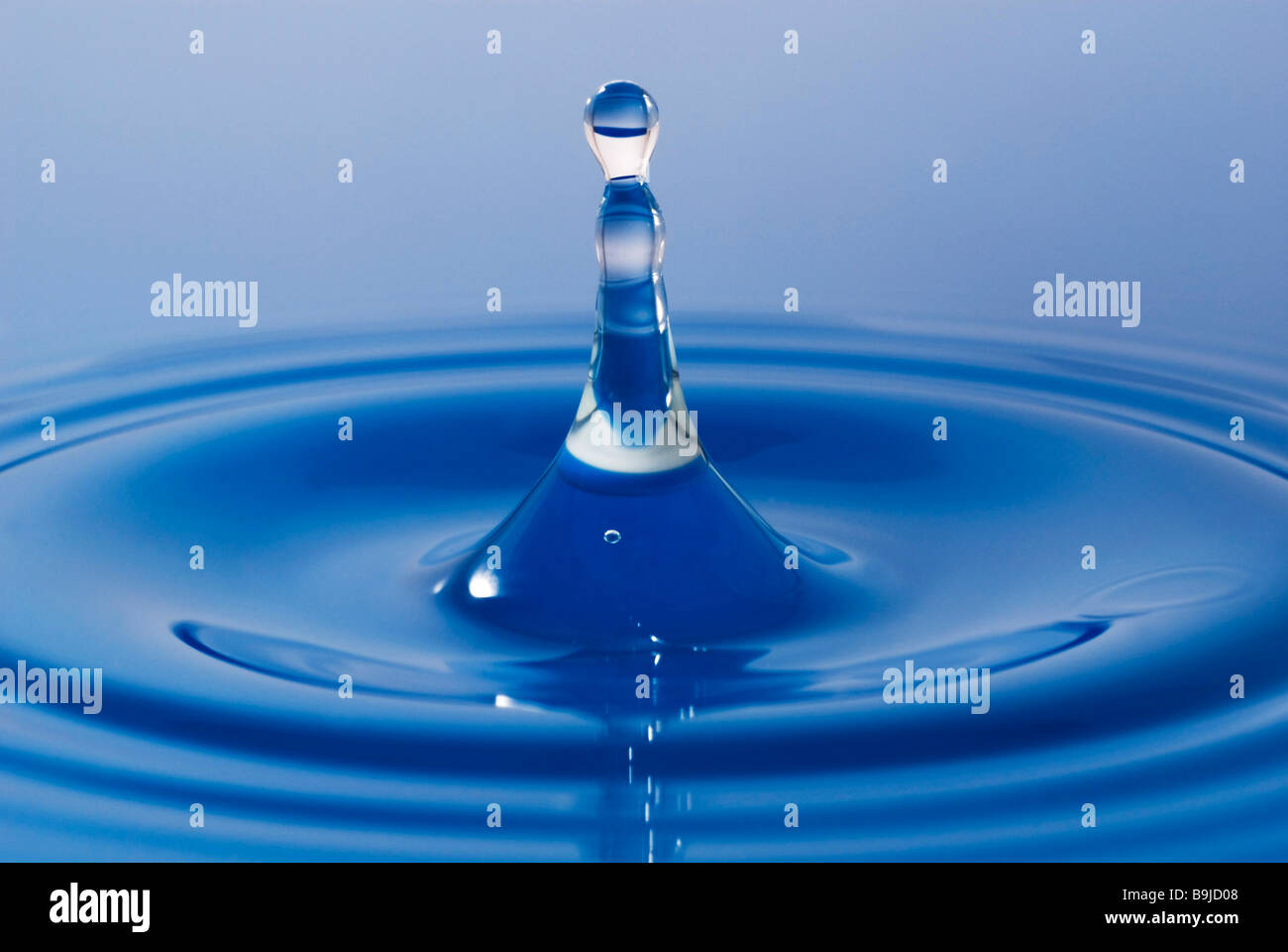 Drop of water, blue Stock Photo - Alamy