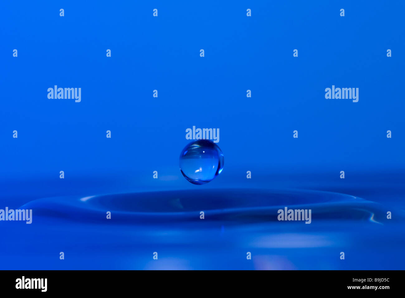 Coloured water drops, blue Stock Photo - Alamy