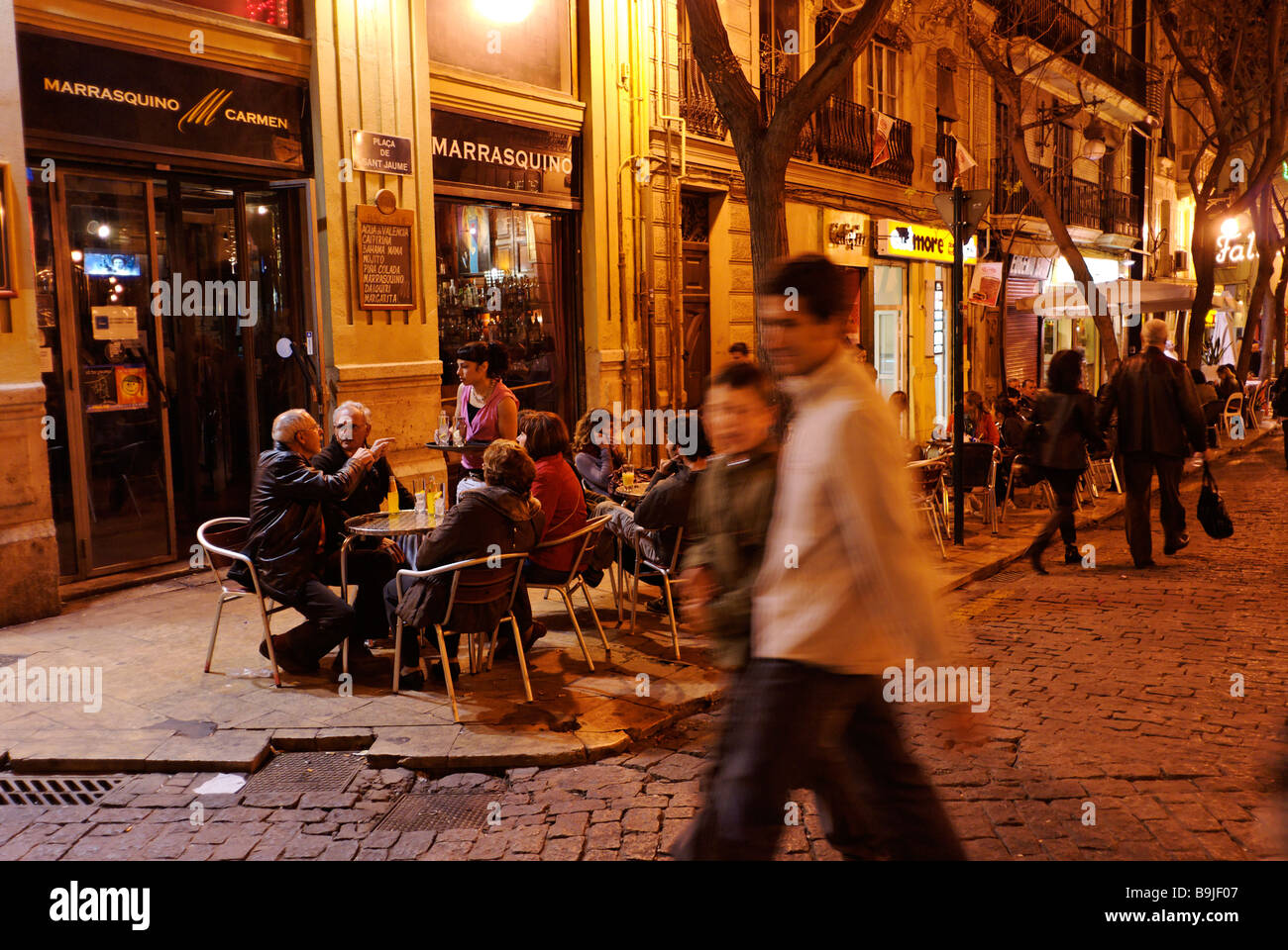 Busy street cafe at Plaza Tossal in the narrow alleyways of El Carmen ...