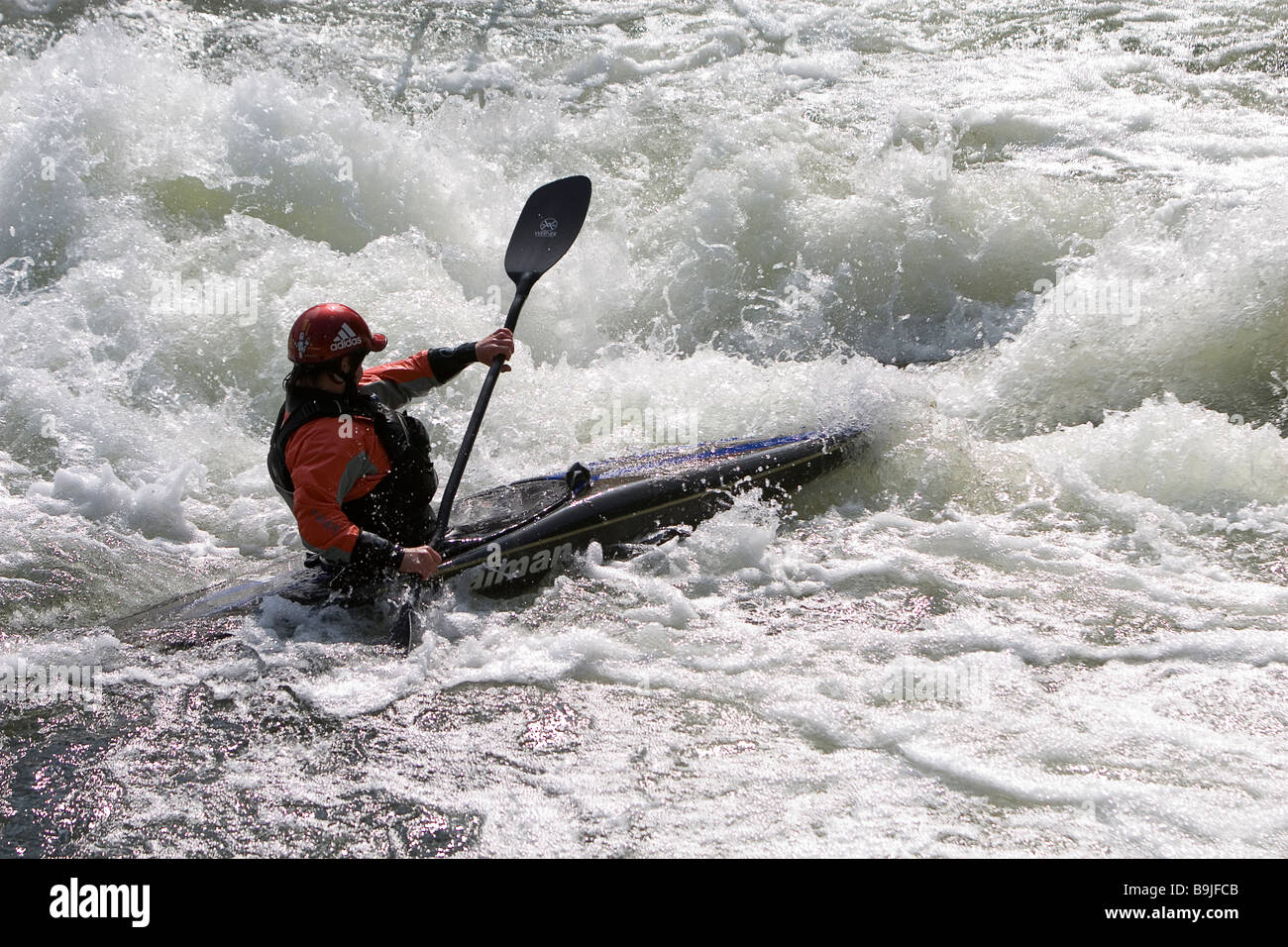White water canoeing on the River Thames at Shepperton Weir Stock Photo ...