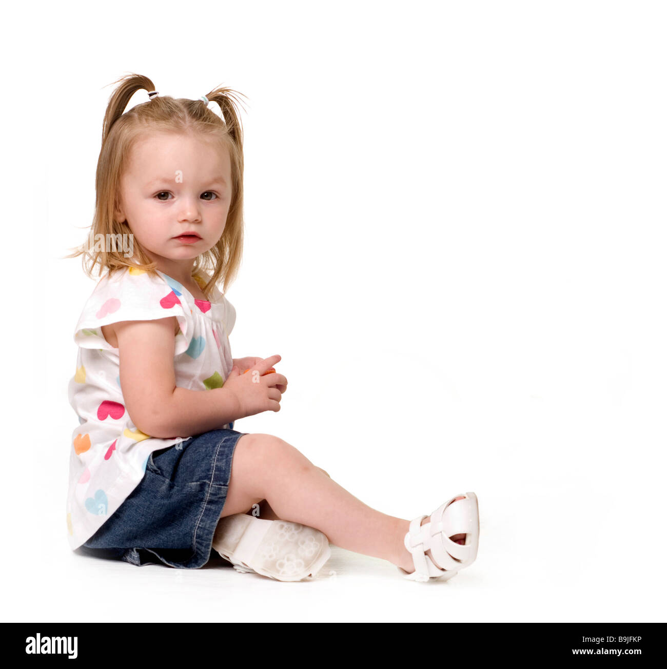 Adorable little girl with pig tails Stock Photo - Alamy