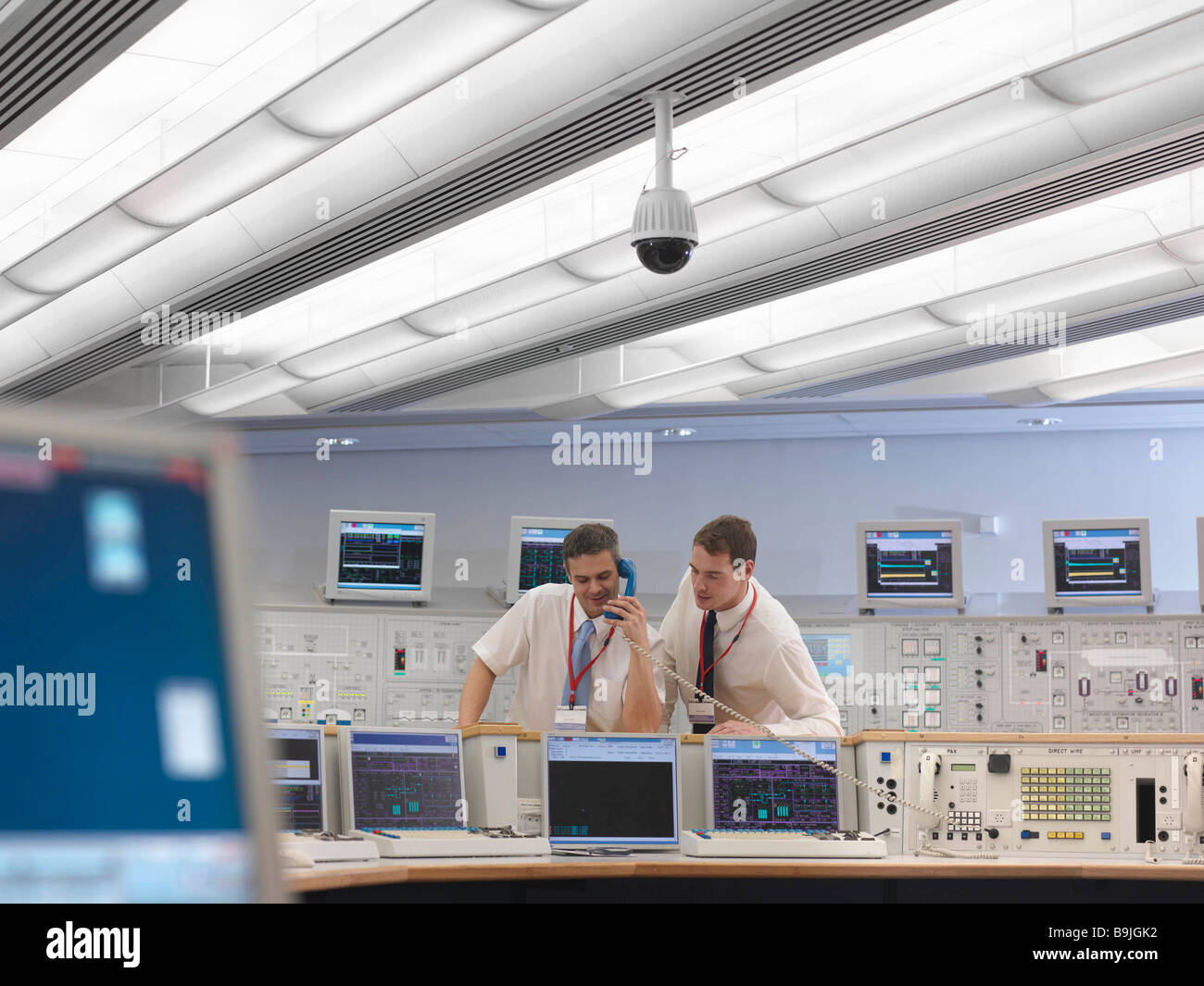 Technology communication on the phone control room working hi-res stock ...