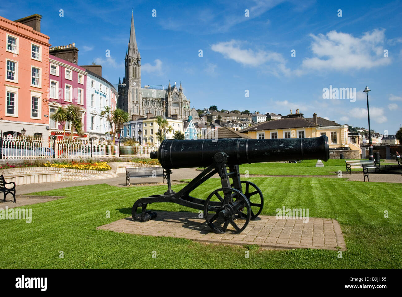 Cannon in Cobh waterfront park with St Colman's Cathedral in the ...