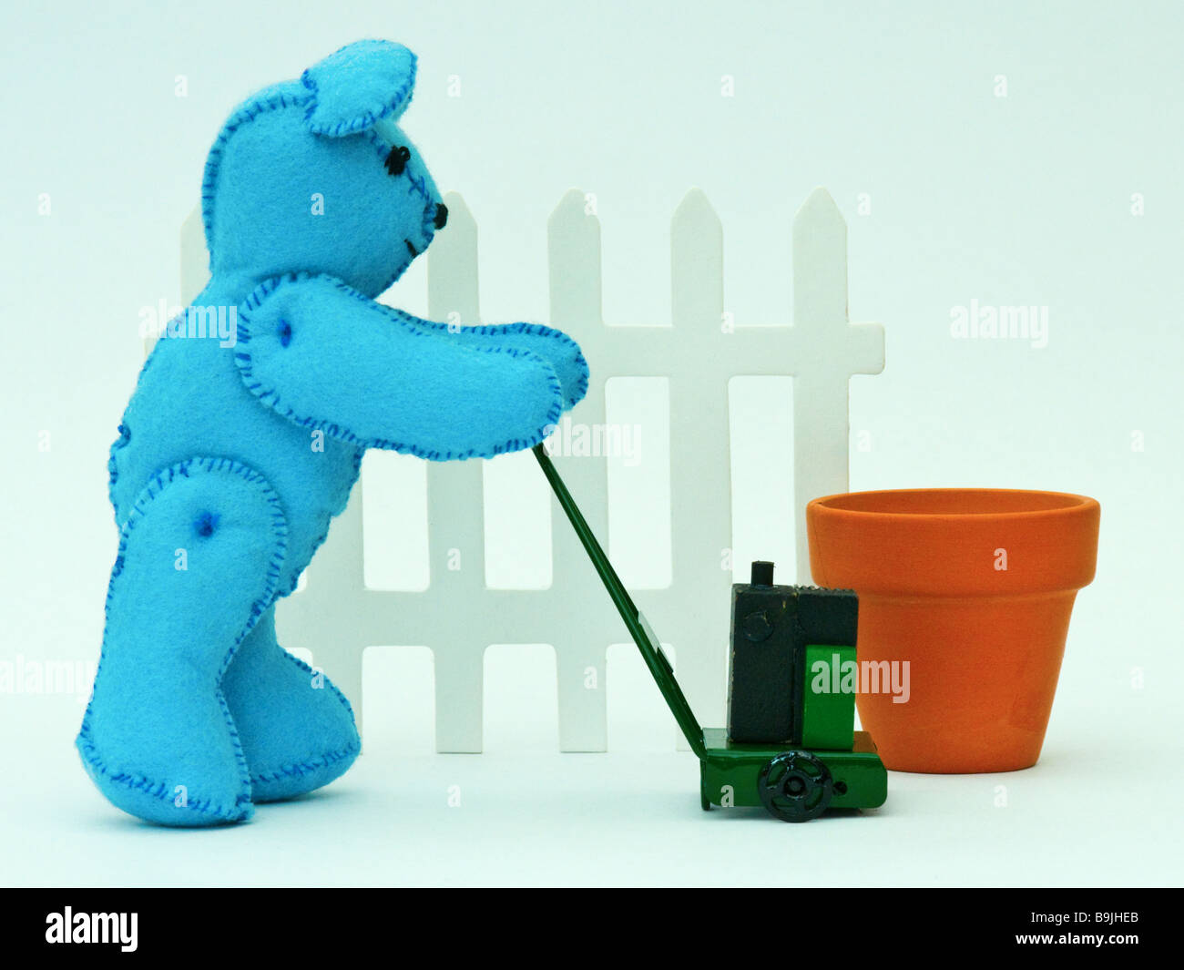 Miniature teddy bear mowing (Mini Bear Collection Stock Photo - Alamy