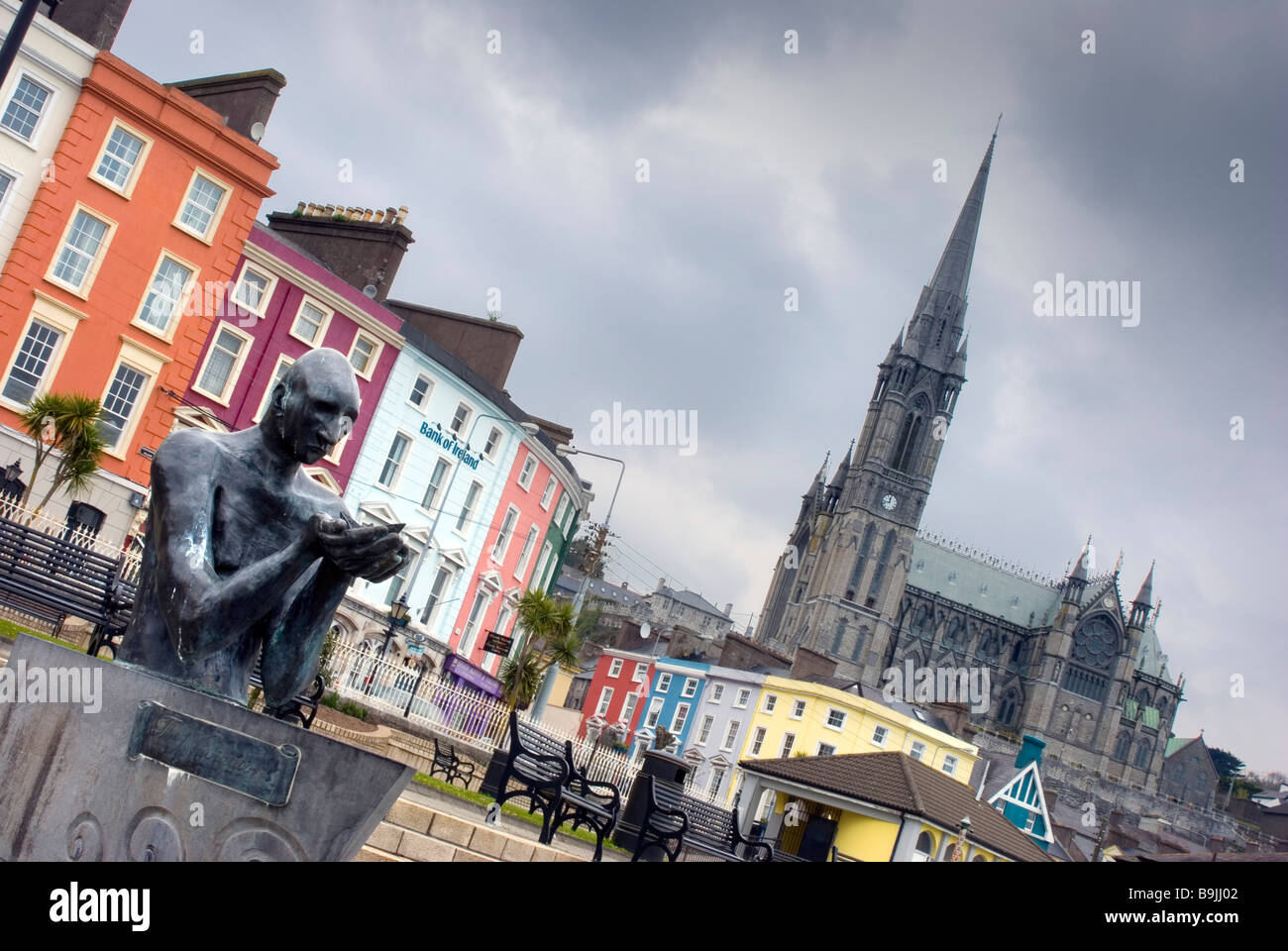 The navigator statue and Cobh waterfront with St. Colman's Cathedral in ...