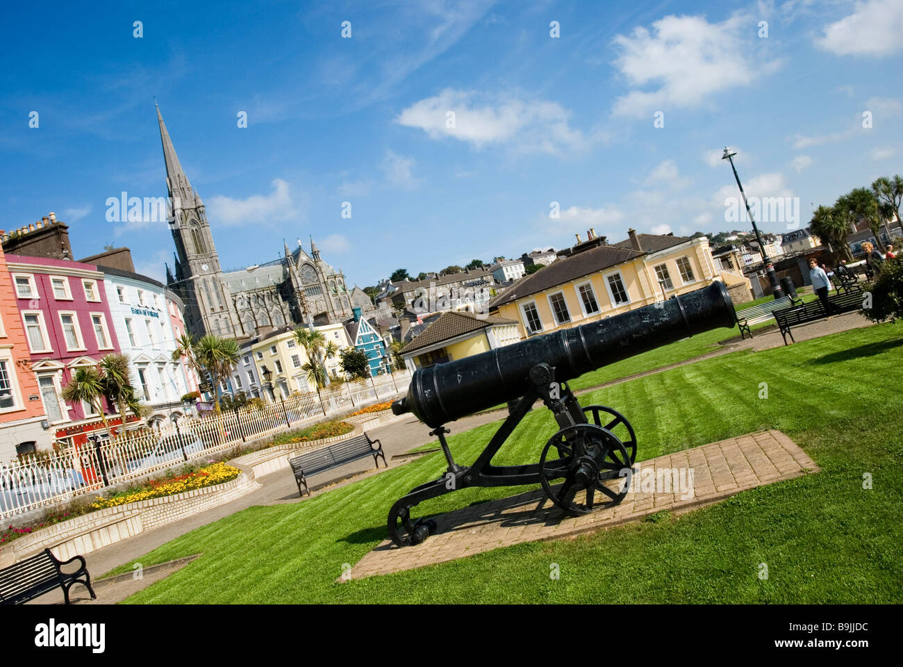 Cannon in Cobh waterfront park with St Colman's Cathedral in the ...