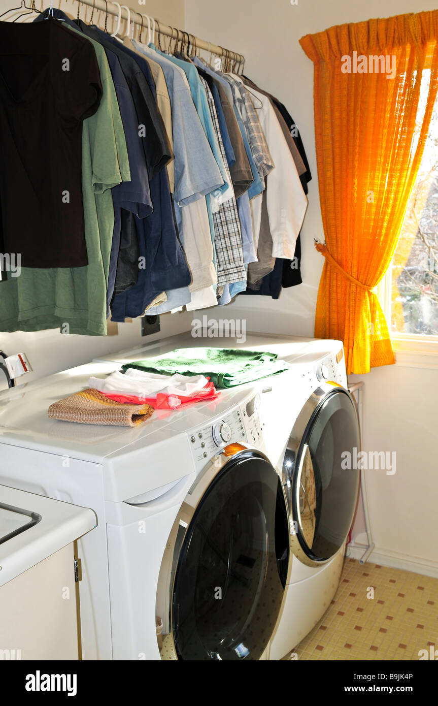 Laundry room with modern washer and dryer Stock Photo - Alamy