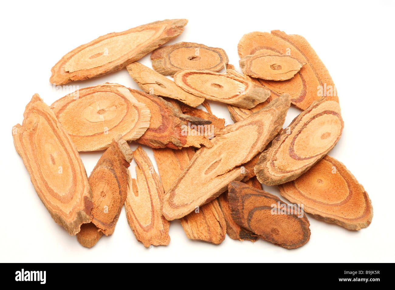 Licorice Root against white background Stock Photo - Alamy