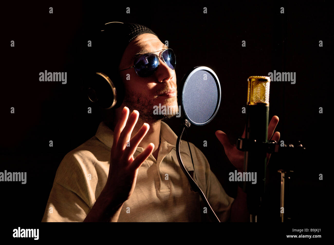 Singer at audio recording studio Stock Photo - Alamy