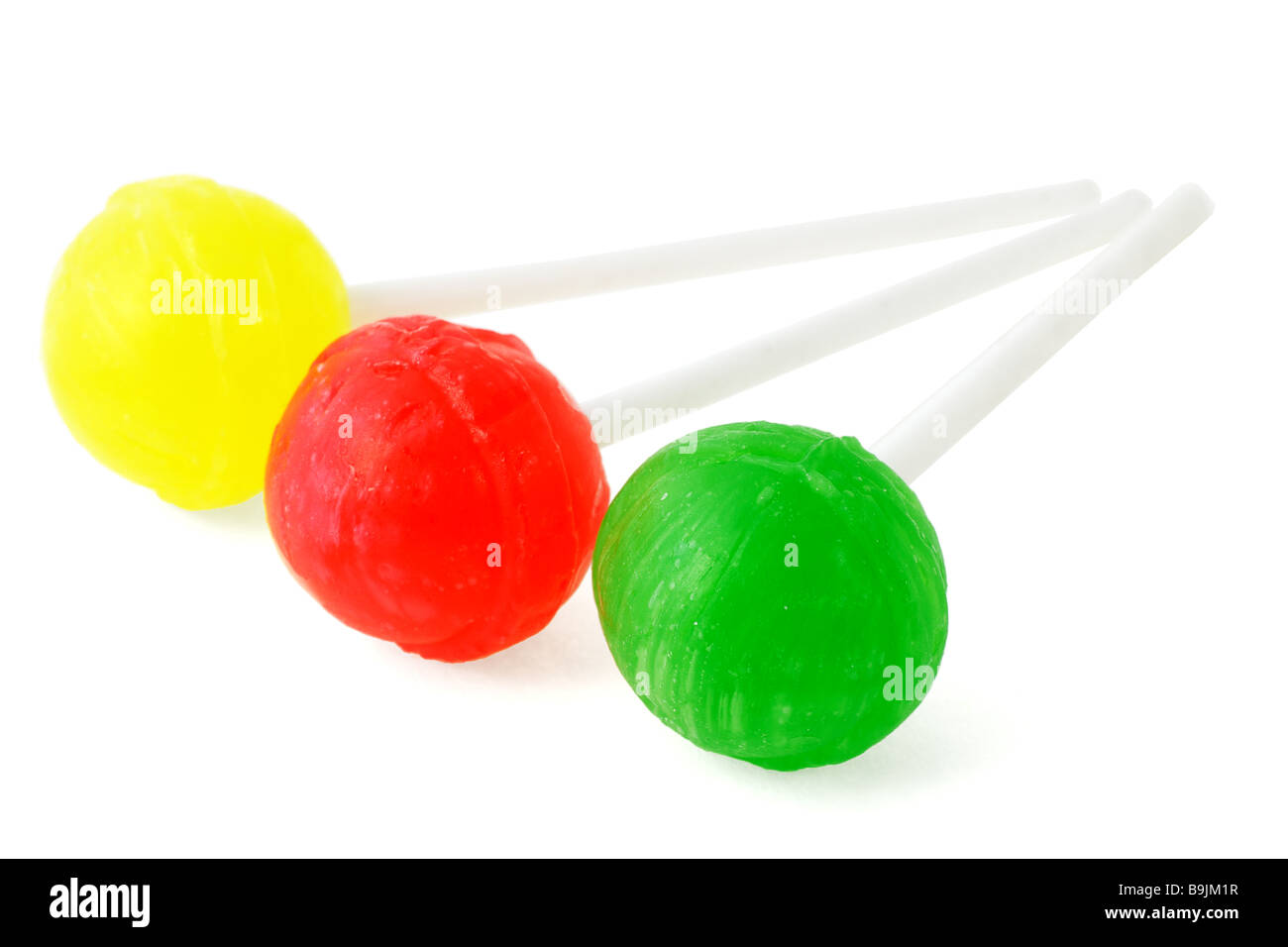 Three colorful lollipops isolated on white background Stock Photo - Alamy