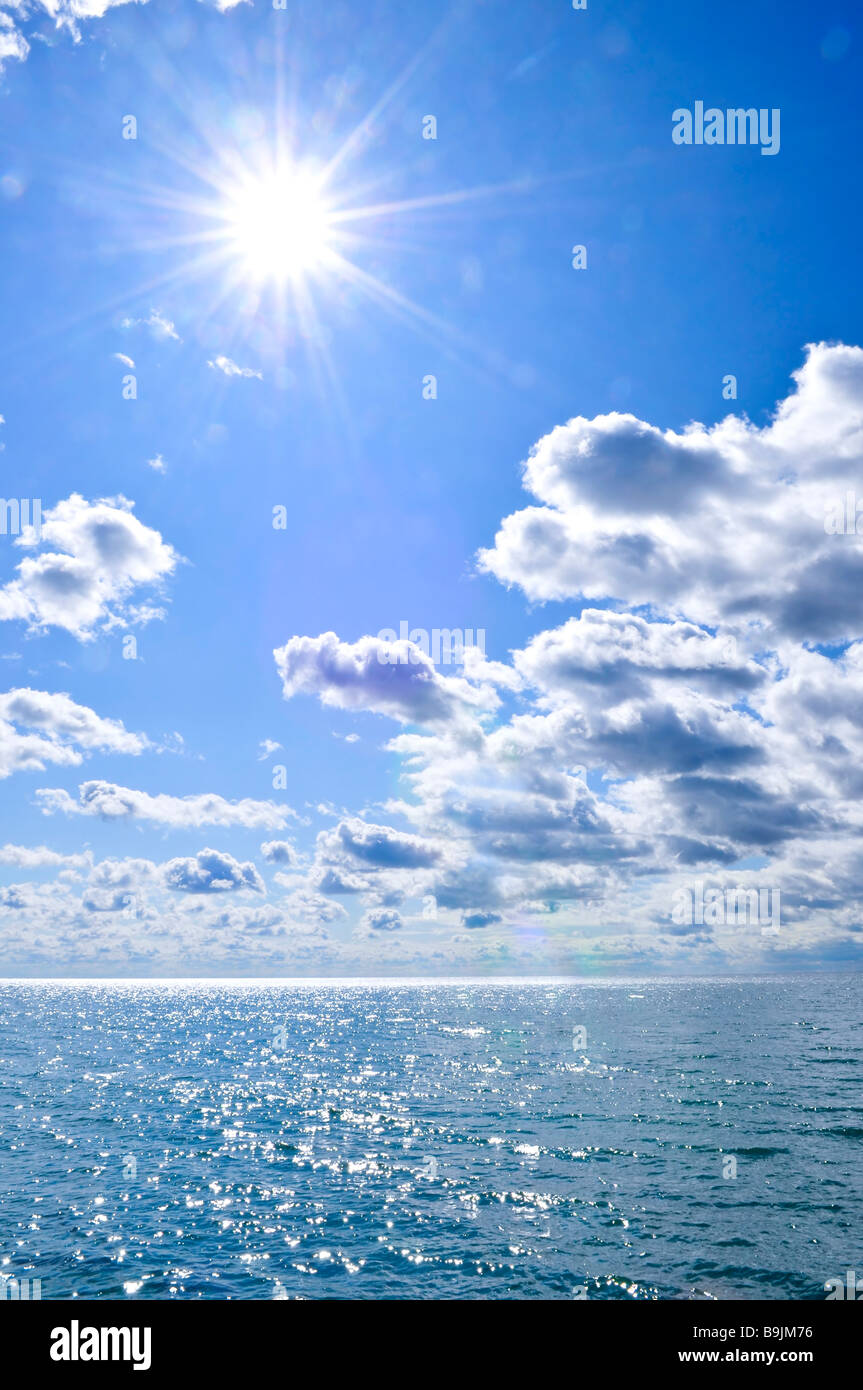 Blue ocean water and sunny sky background Stock Photo - Alamy