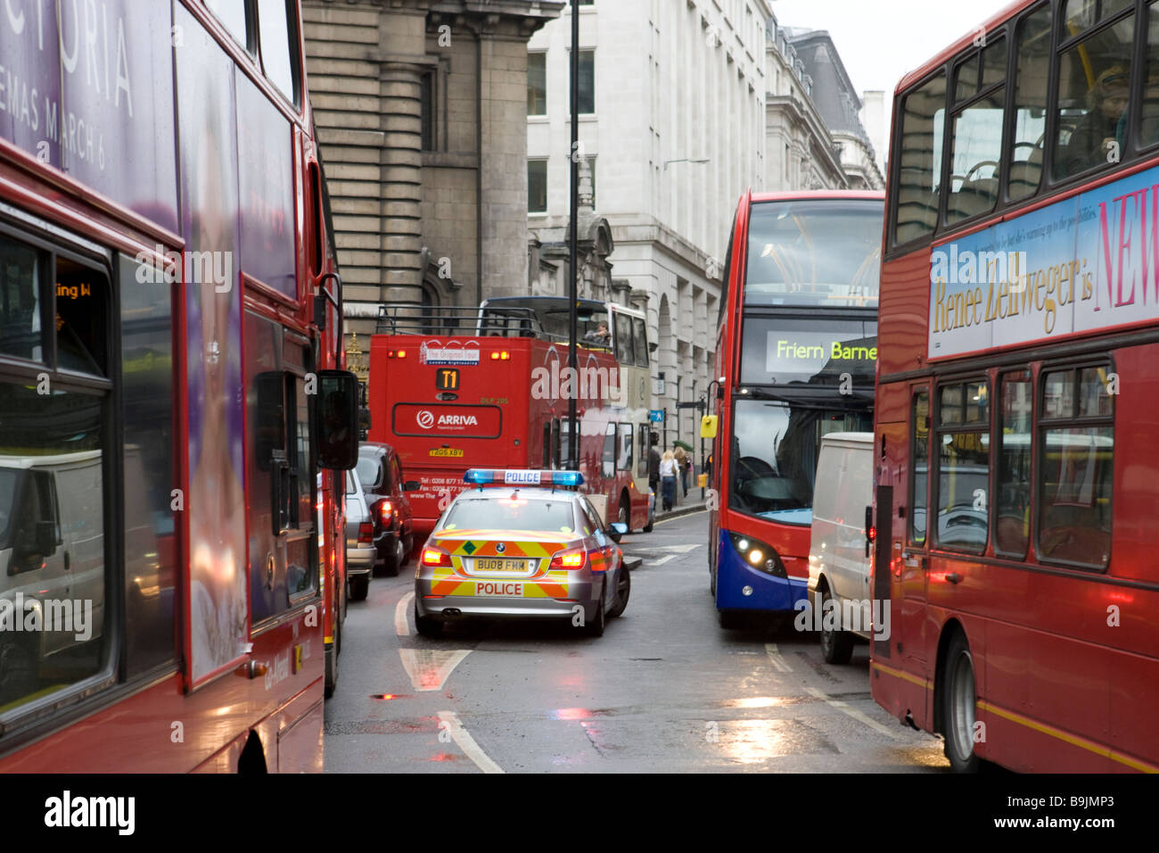 Police car and buses stuck in London traffic jam, England Stock Photo ...