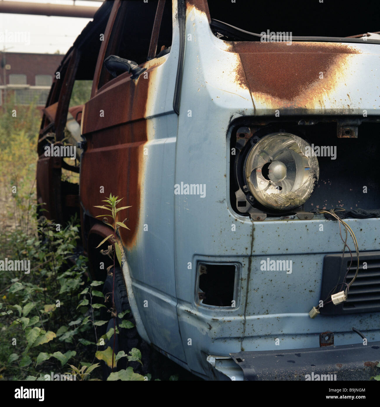 Scrap metal-place minibus rusty discards grass vehicle bus old bushes ...