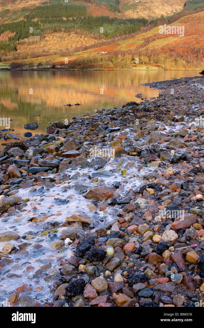 Reflections in Loch Leven at the village of Invercoe near Ballachulish ...