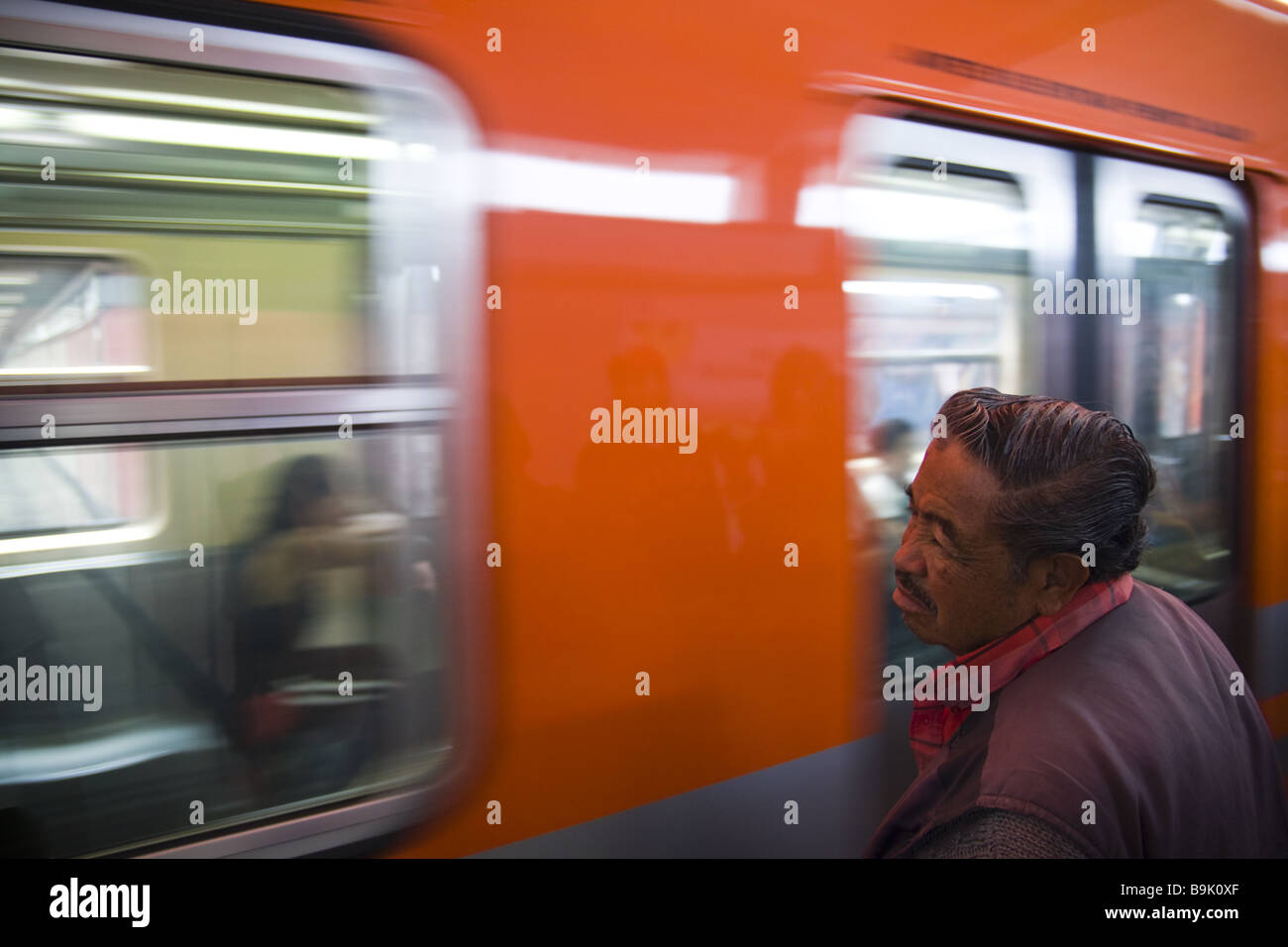 A man watches as a train enters Metro Talisman, a station on Line 4 in ...
