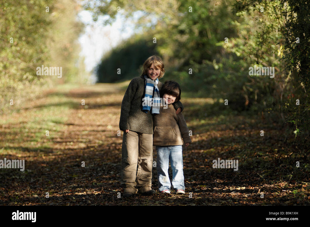 Two boys on country lane Stock Photo - Alamy
