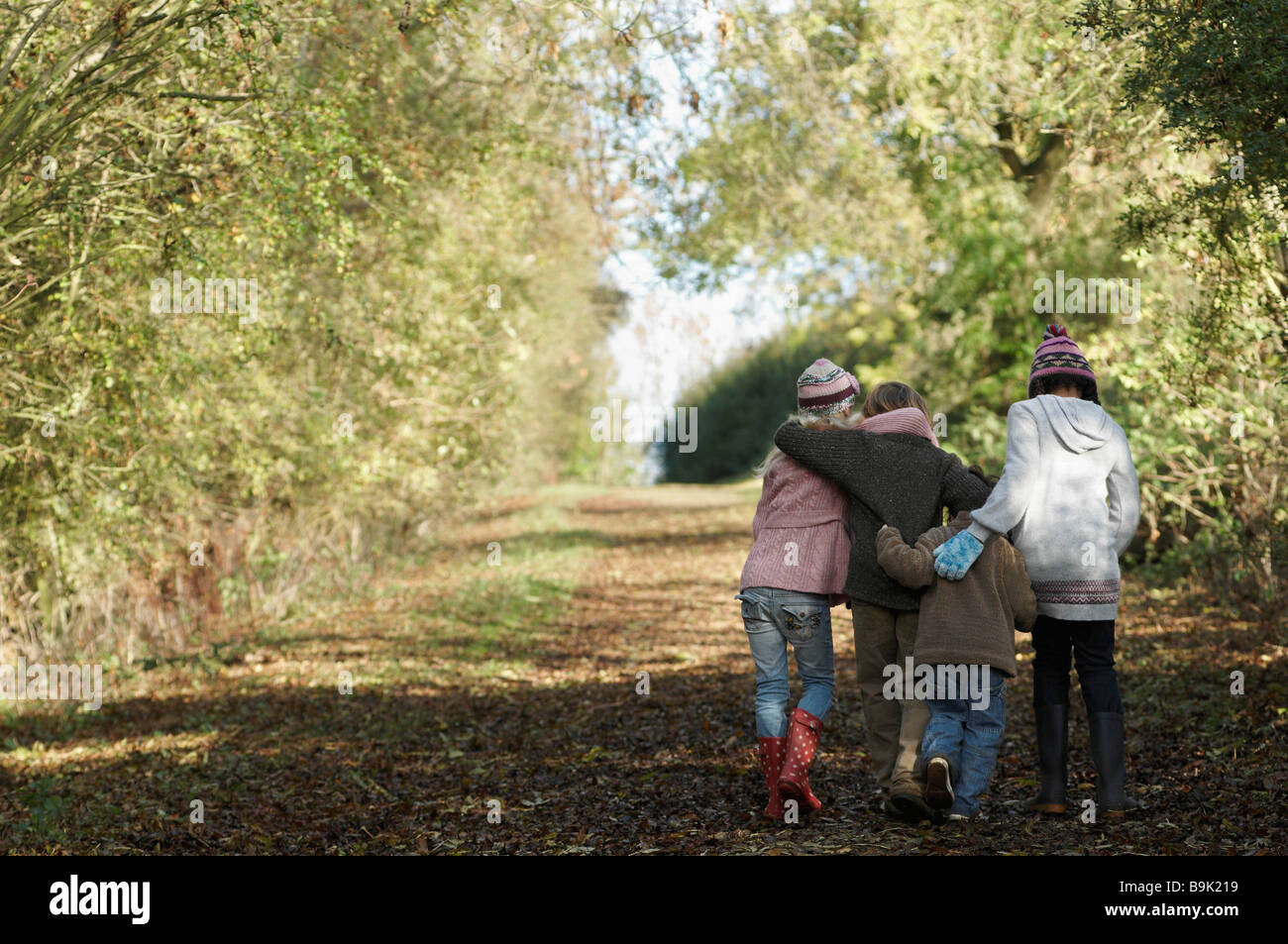 Children walking up country lane Stock Photo - Alamy