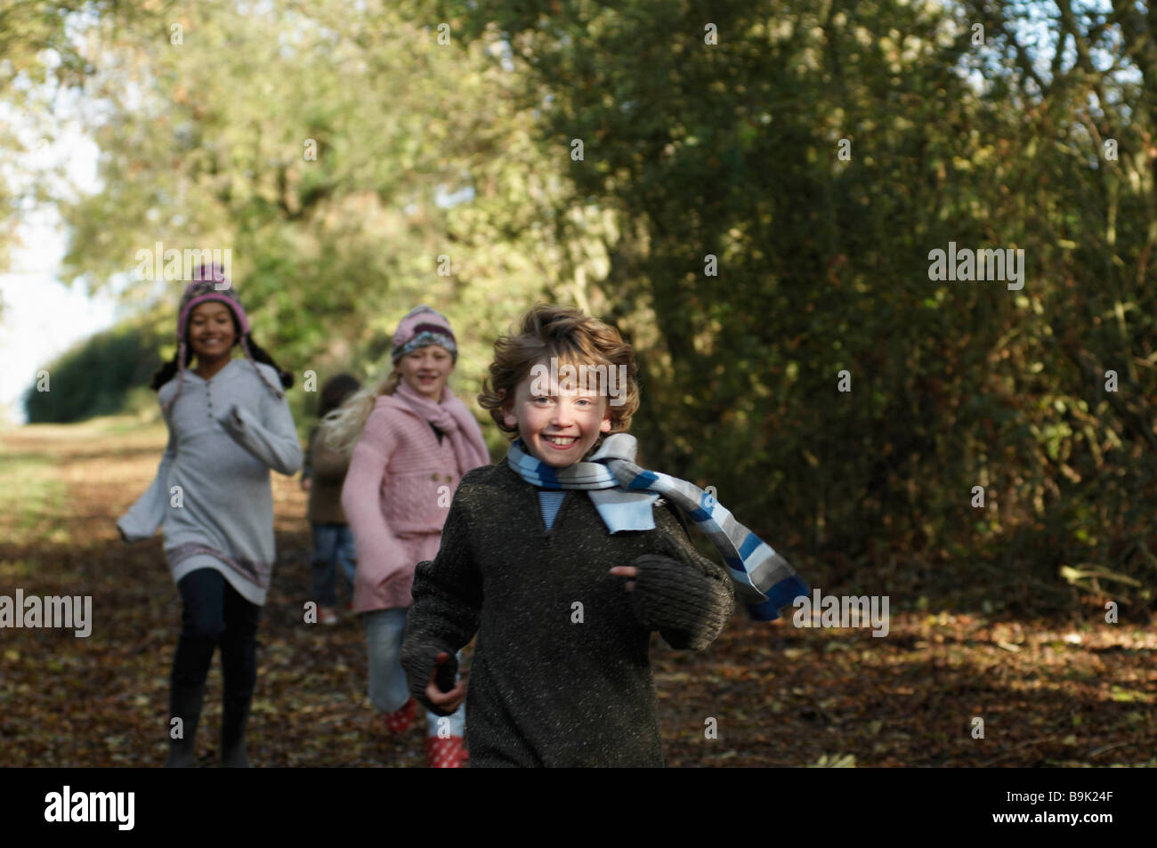 Children running down country lane Stock Photo - Alamy