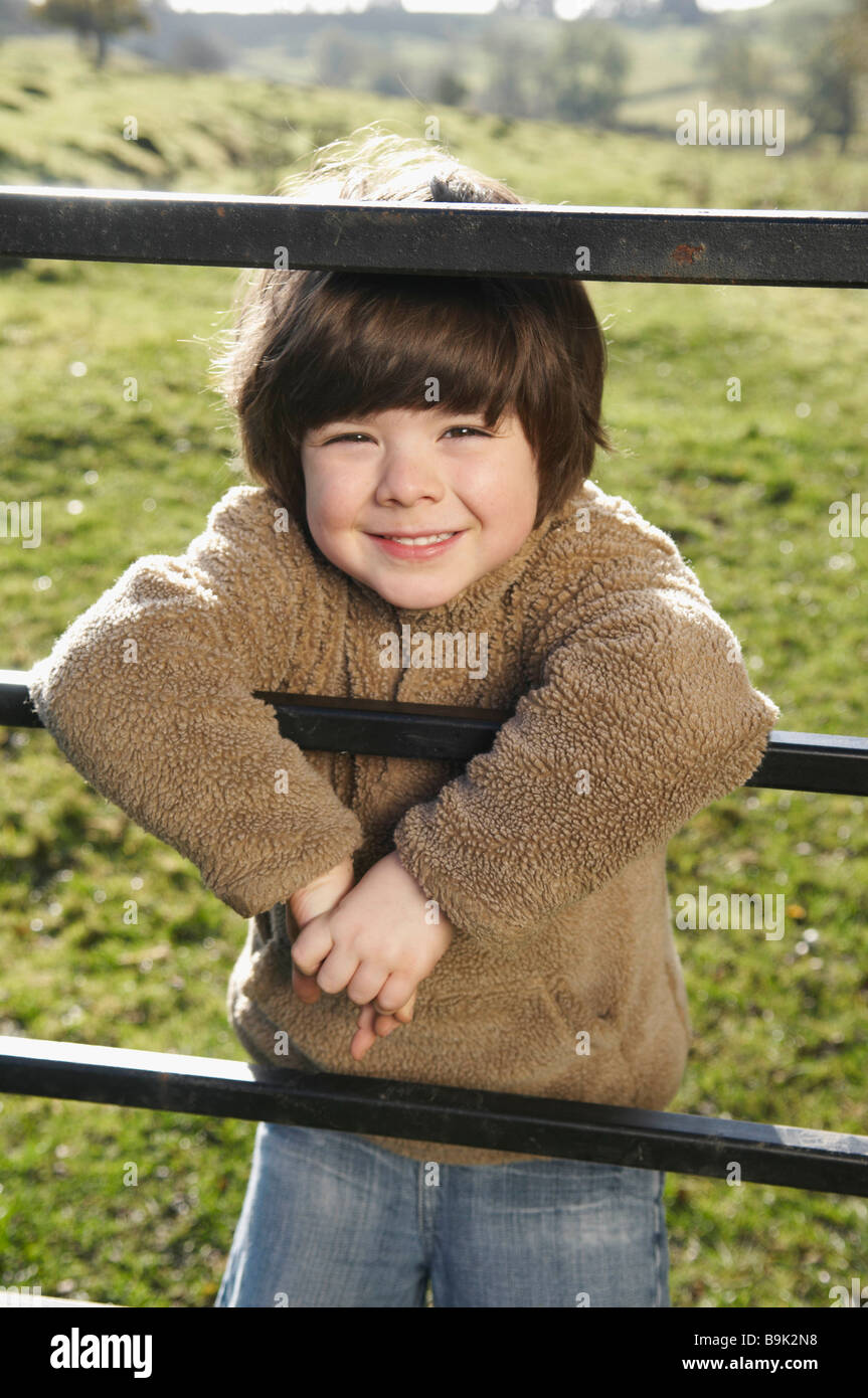 Boy on gate hi-res stock photography and images - Alamy