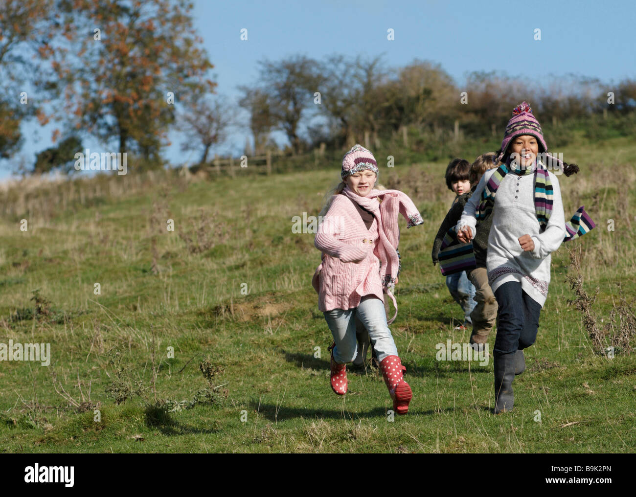 Children running in countryside Stock Photo - Alamy