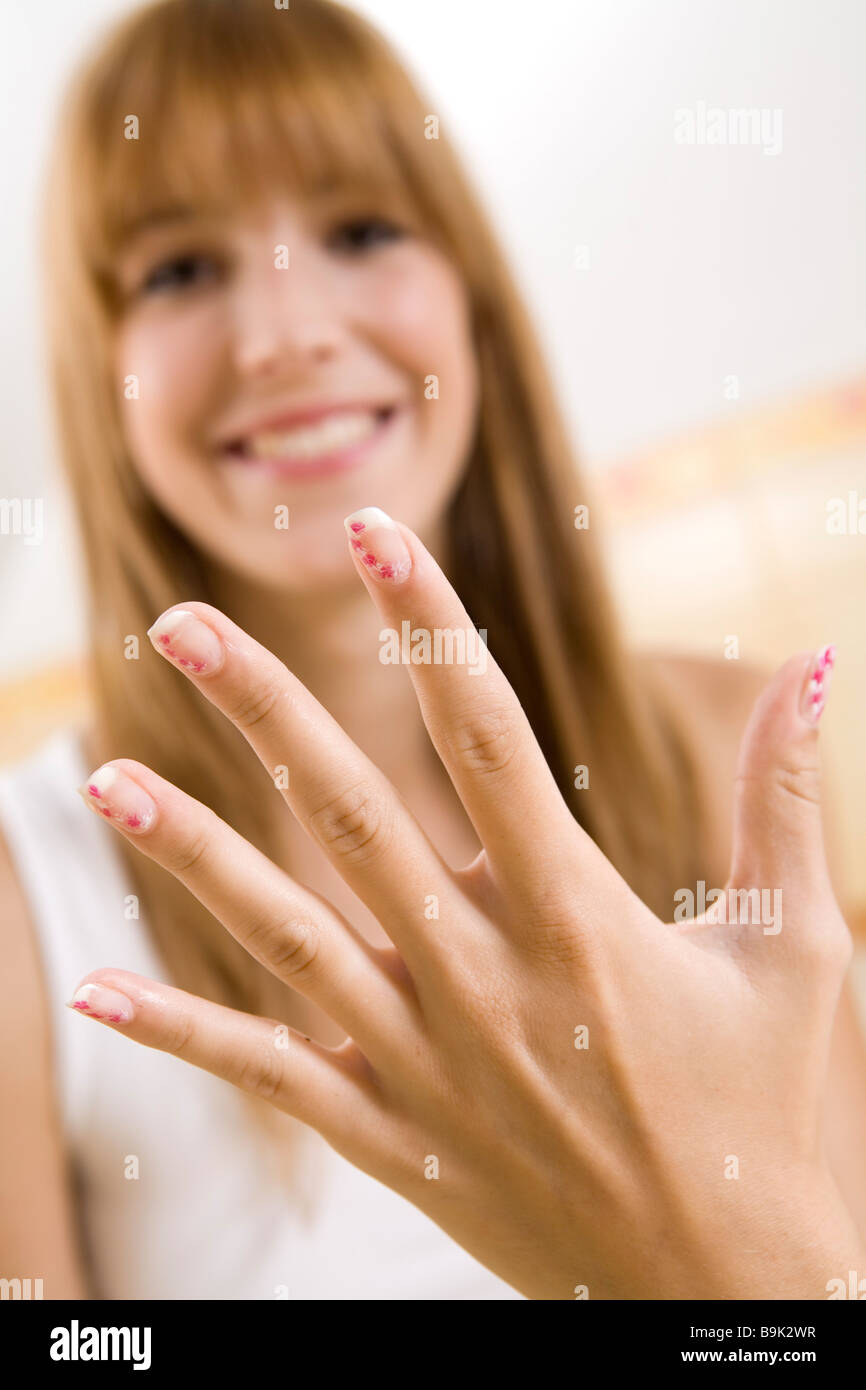Young woman showing her hand Stock Photo - Alamy