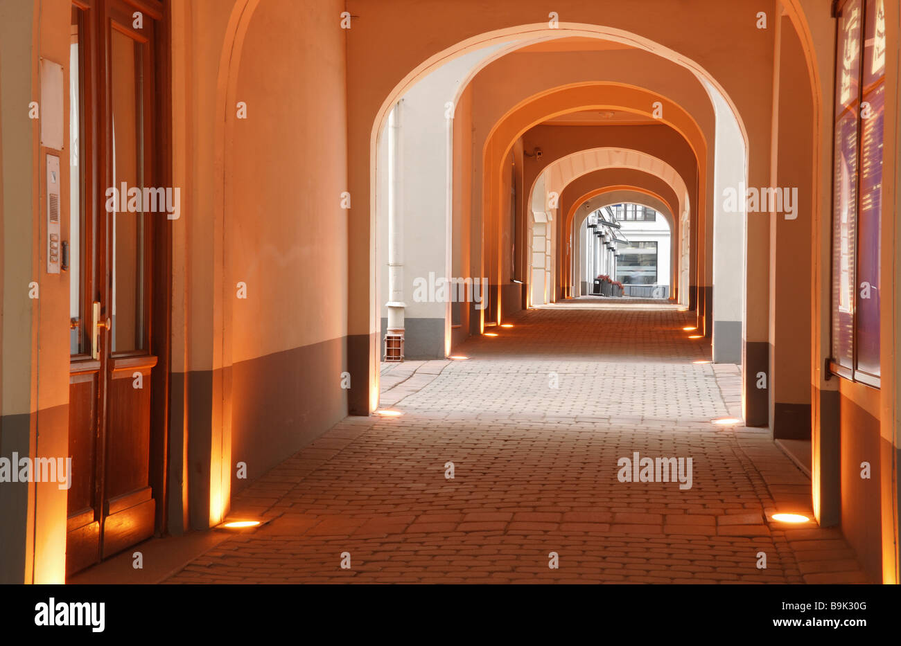 Arch gallery in the ancient street in Riga Stock Photo - Alamy
