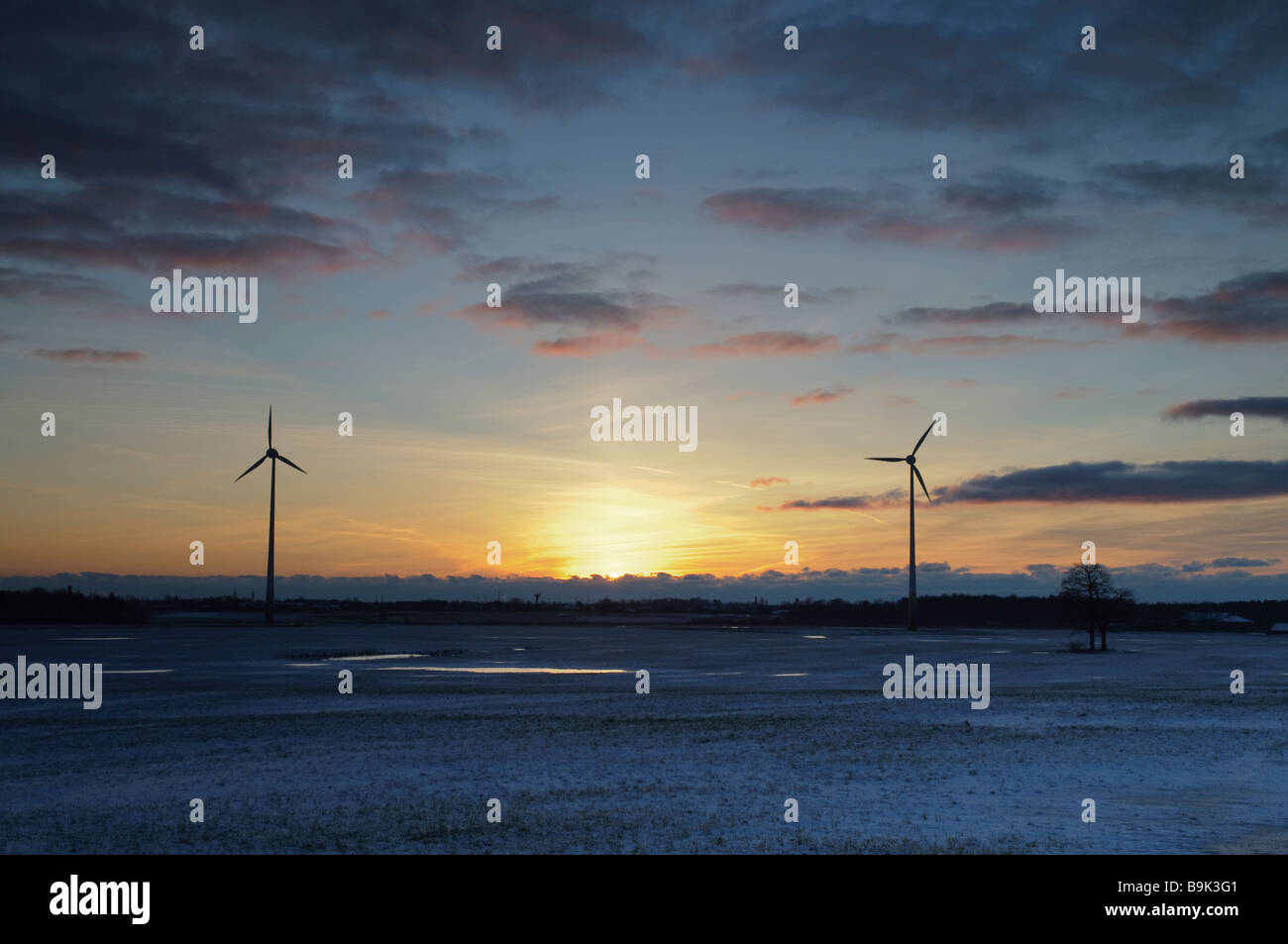Wind farm at sunset Stock Photo - Alamy