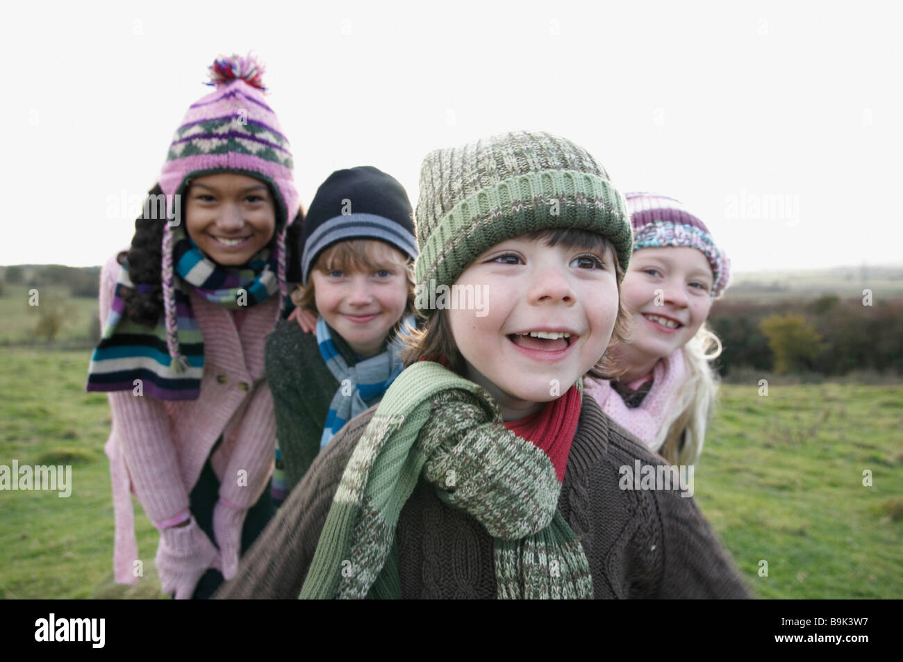 Children playing in field Stock Photo - Alamy