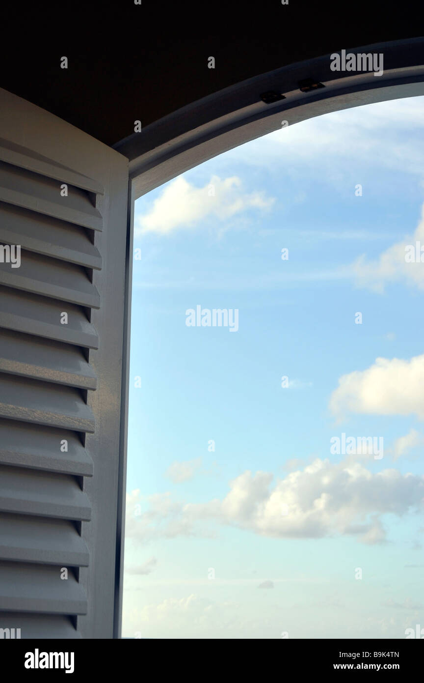 Open shutter blue sky and clouds Stock Photo - Alamy