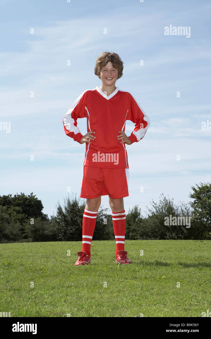 Young Male footballer standing Stock Photo - Alamy