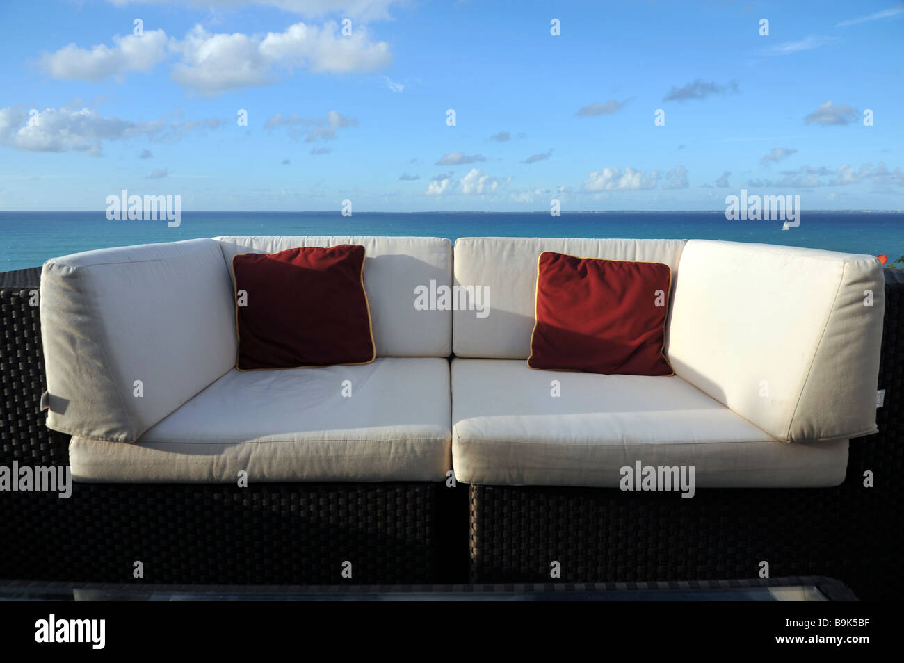 Sofa on an oceanside patio Stock Photo - Alamy