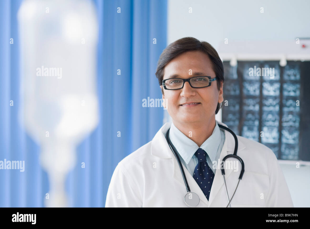Portrait of a doctor smiling Stock Photo - Alamy