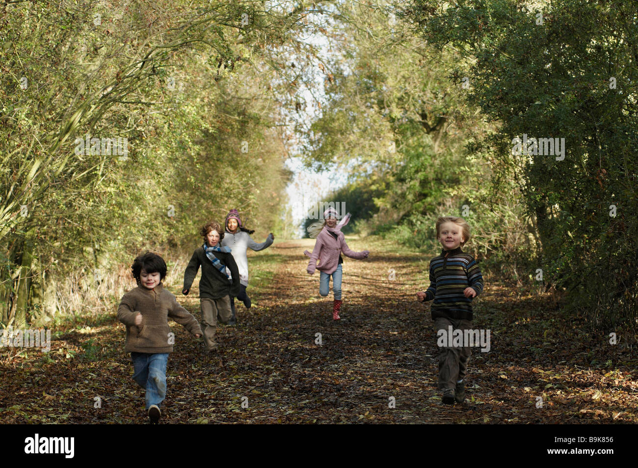 Children running down country lane Stock Photo - Alamy