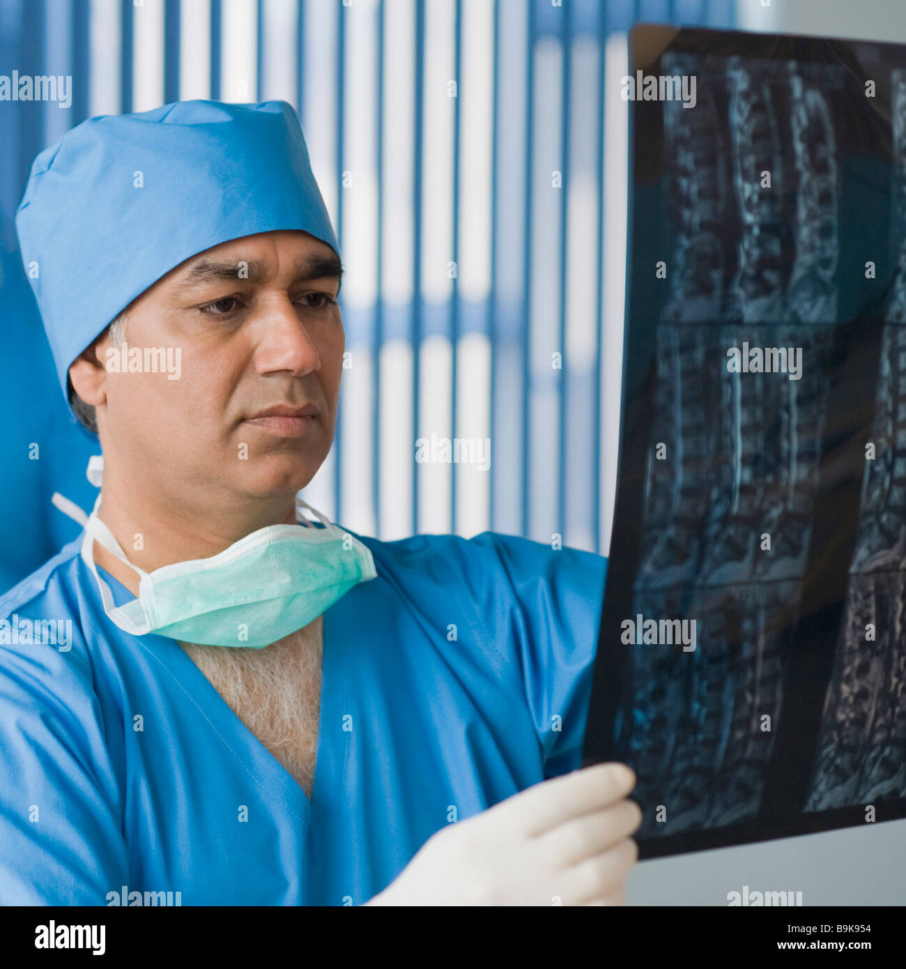 Surgeon examining an x-ray report Stock Photo - Alamy