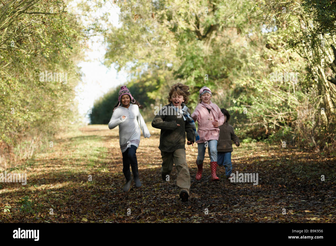 Children running down country lane Stock Photo - Alamy