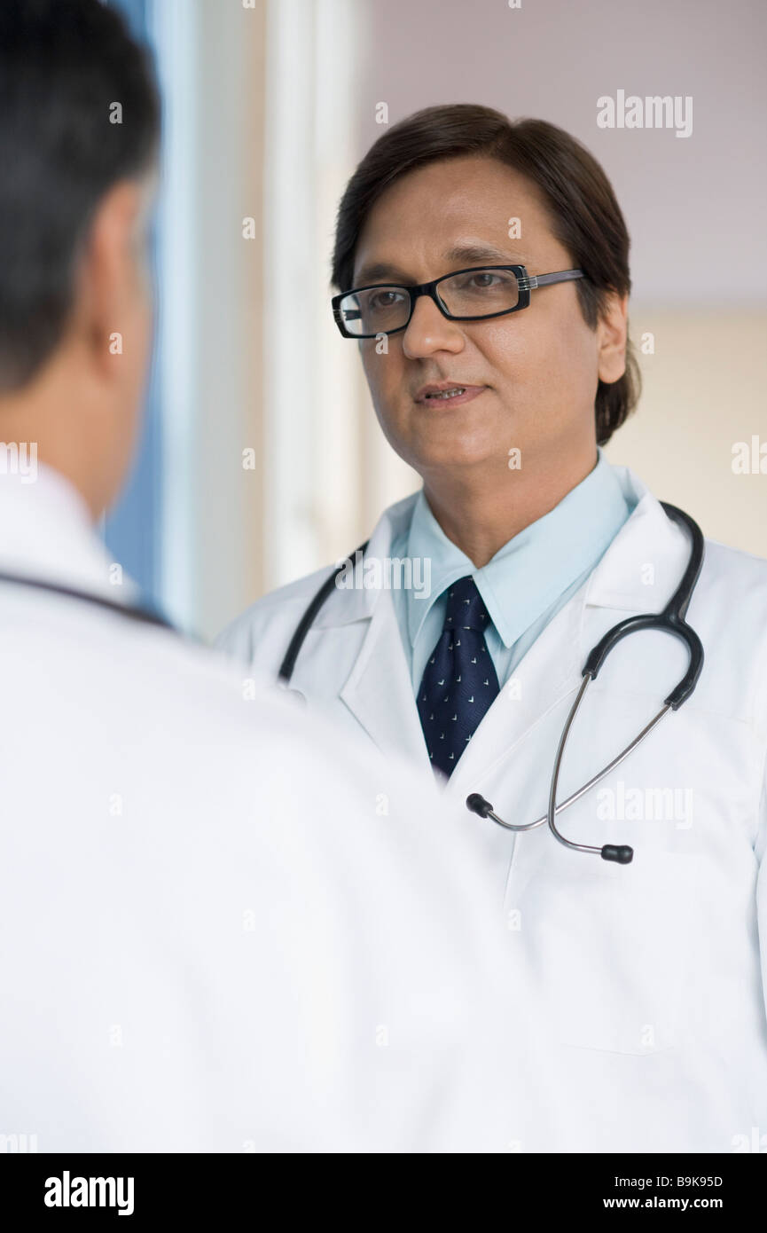 India doctor discussion with two people hi-res stock photography and ...